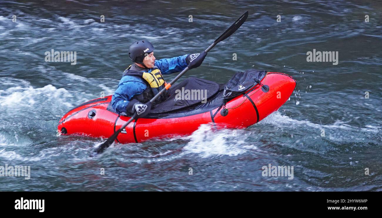 Man wearing suit kayaking hi-res stock photography and images - Alamy