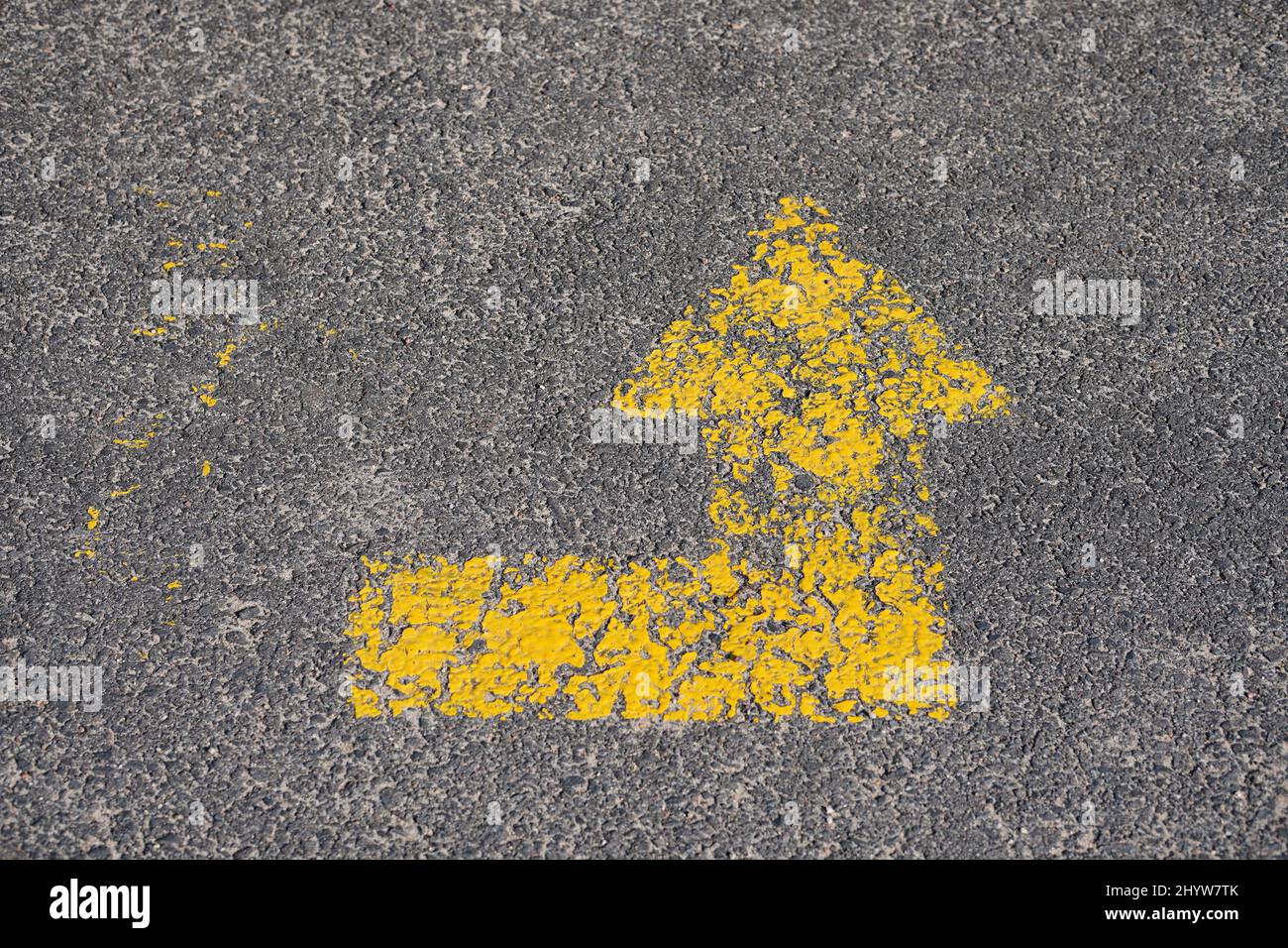 Painted yellow arrow Stock Photo - Alamy
