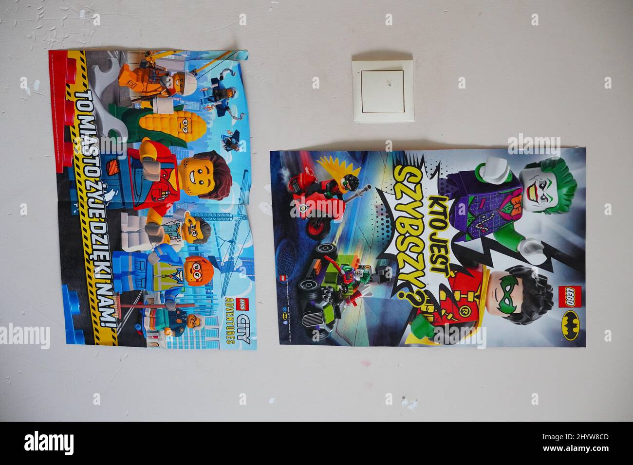Wall with Lego City and DC Comics Batman and Robin banners Stock Photo ...