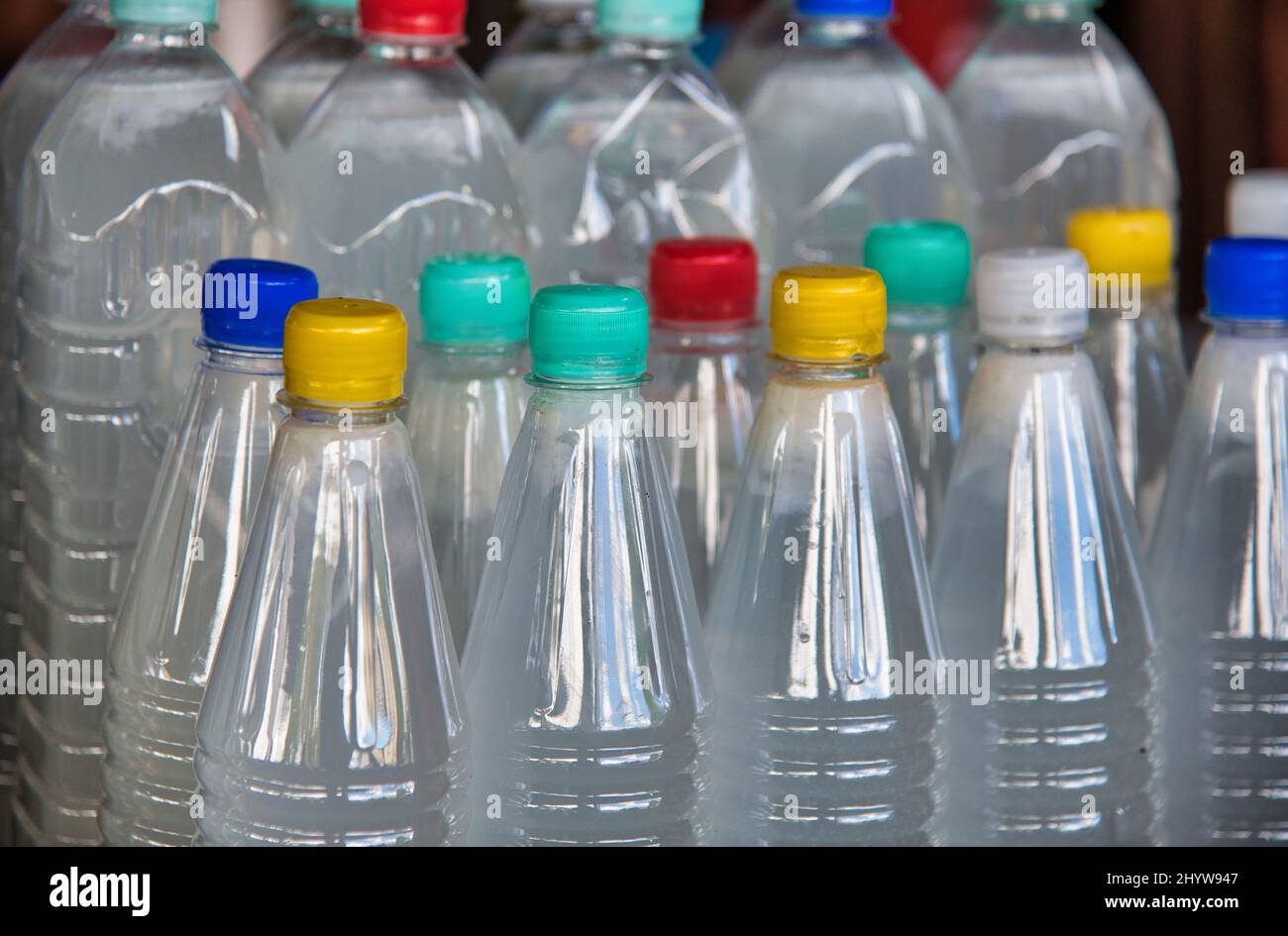 Plastic bottles with colourful caps Stock Photo - Alamy