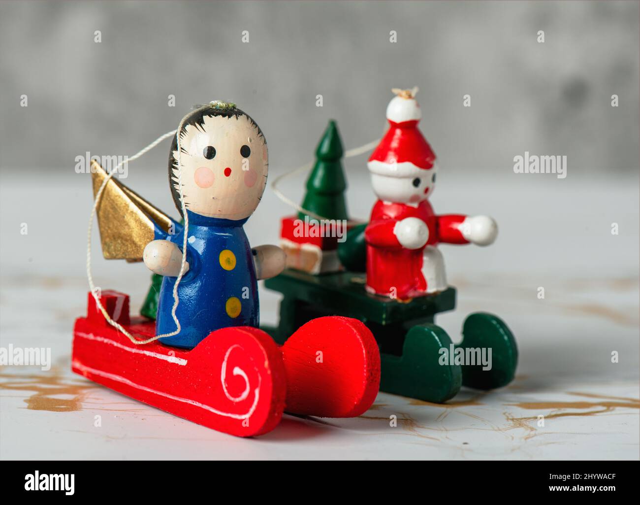 Wooden Christmas decorations of a blue angle and small Santa Father ...