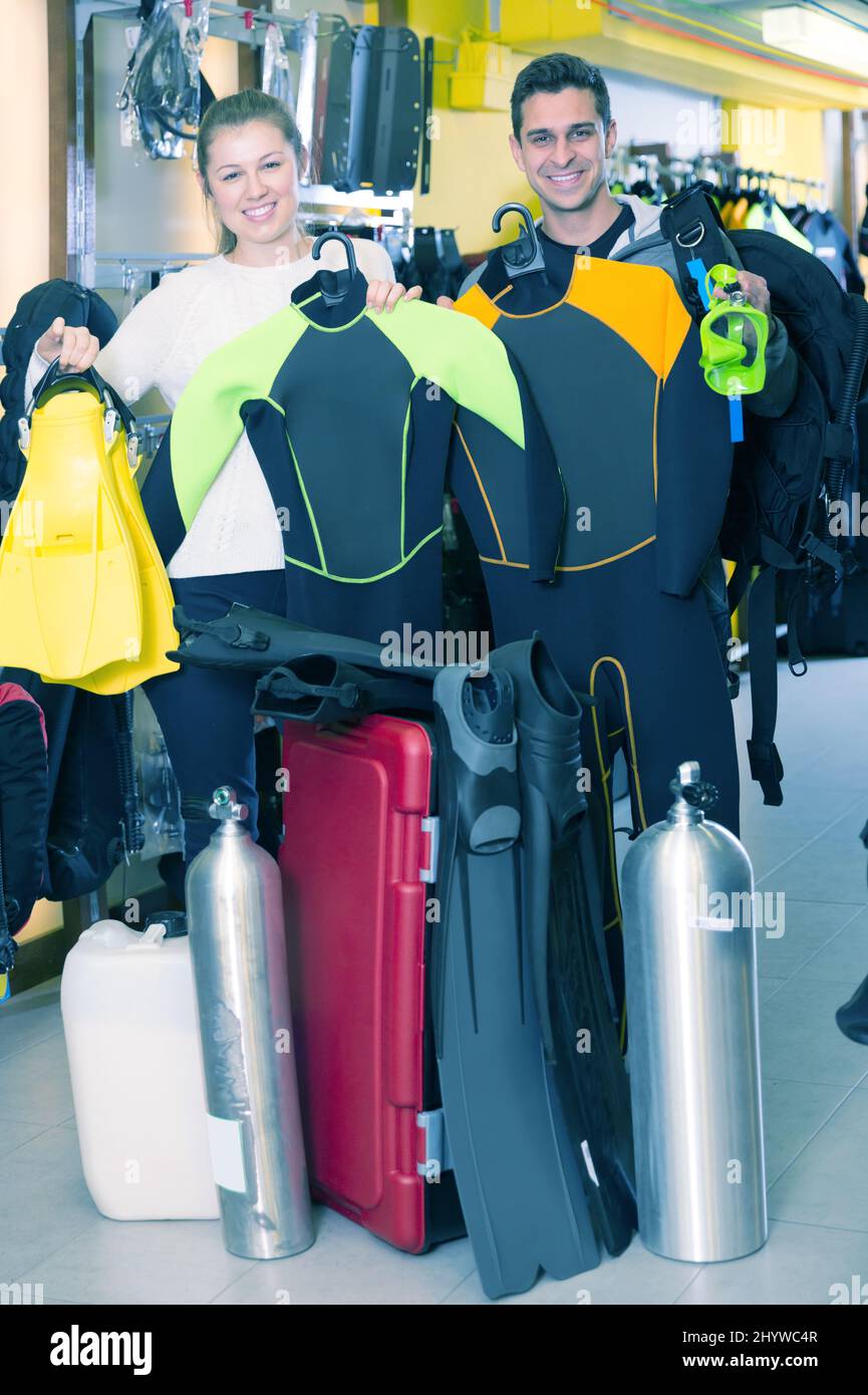 female and man with diving equipment Stock Photo - Alamy