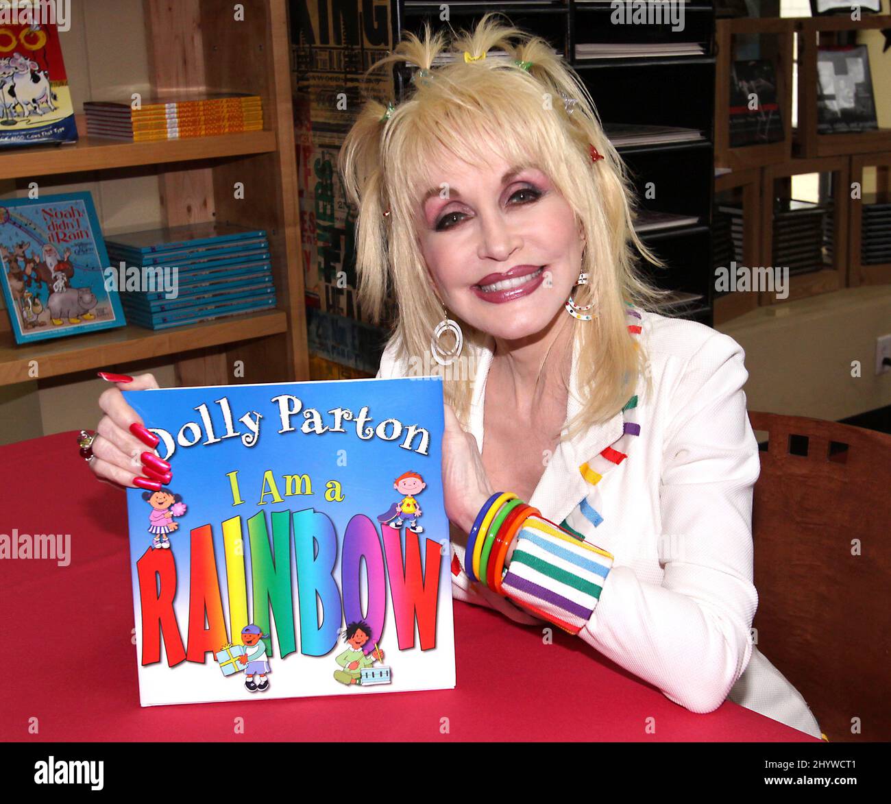 Dolly Parton signs copies of her children's book "I Am a Rainbow" at ...