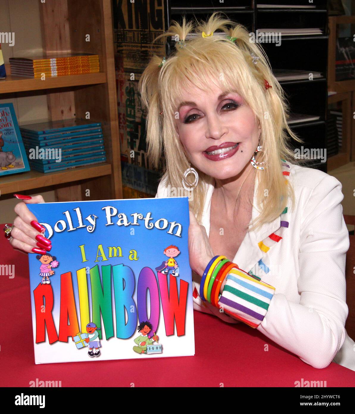 Dolly Parton signs copies of her children's book "I Am a Rainbow" at ...