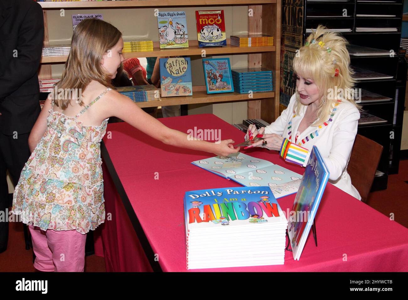 Dolly Parton signs copies of her children's book "I Am a Rainbow" at ...