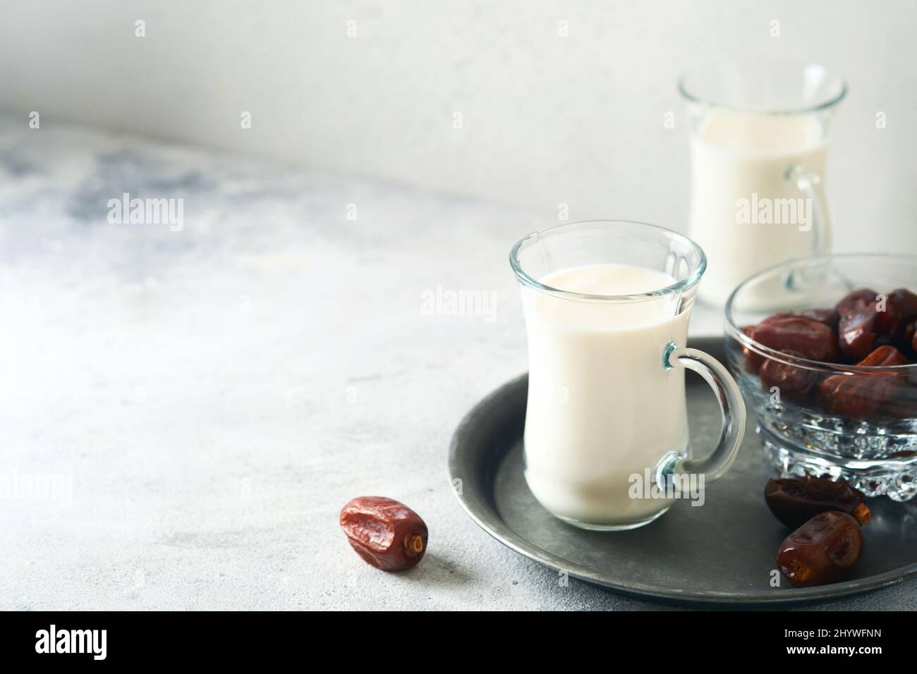 Ramadan Kareem food and drinks. Plate of dates, glass of milk and date ...