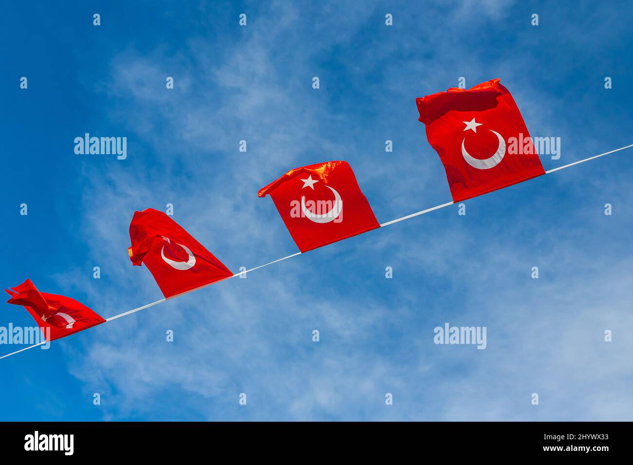 National flags of Turkey on a waving against a blue sky Stock Photo - Alamy