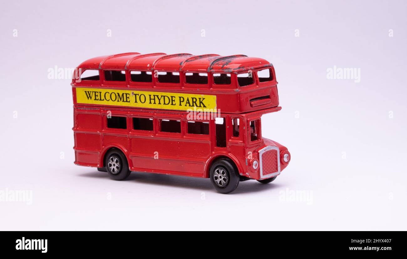 Old model of a red double-decker with a sign Welcome to Hyde Park ...
