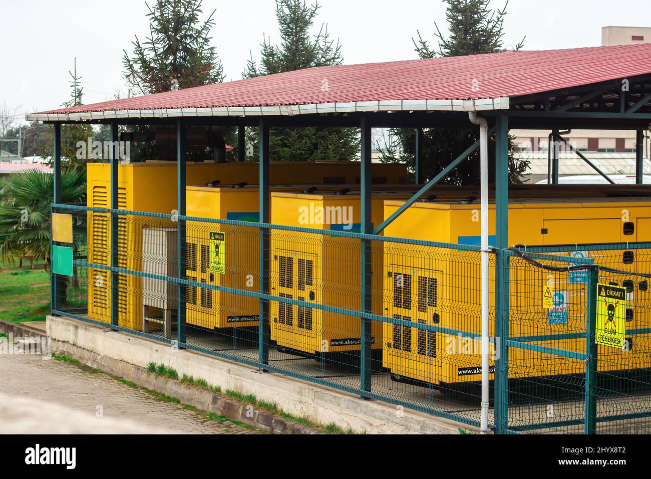 Industrial electric generator for electric power in cage with roof ...