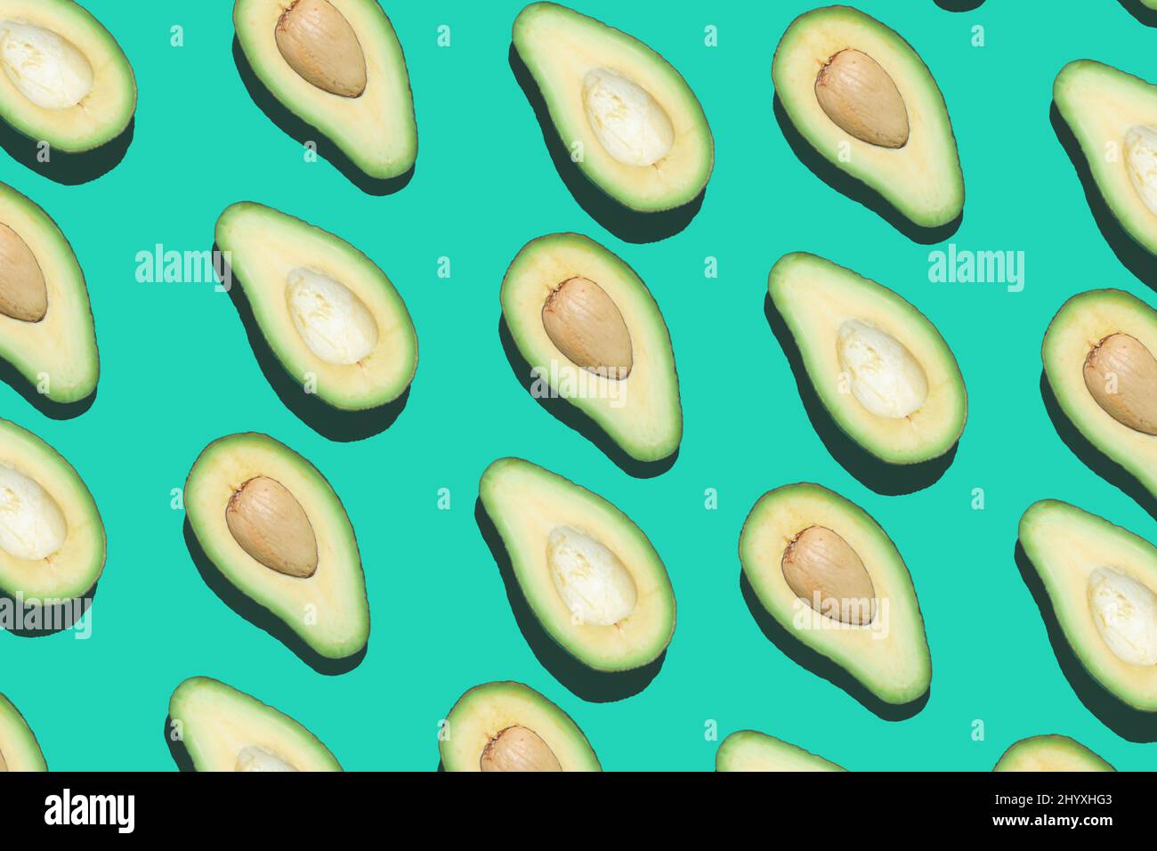 Graphic top view pattern of avocado halves in diagonal lines on ...