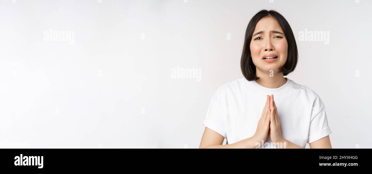 Desperate Crying Asian Woman Begging Asking For Help Pleading And Say