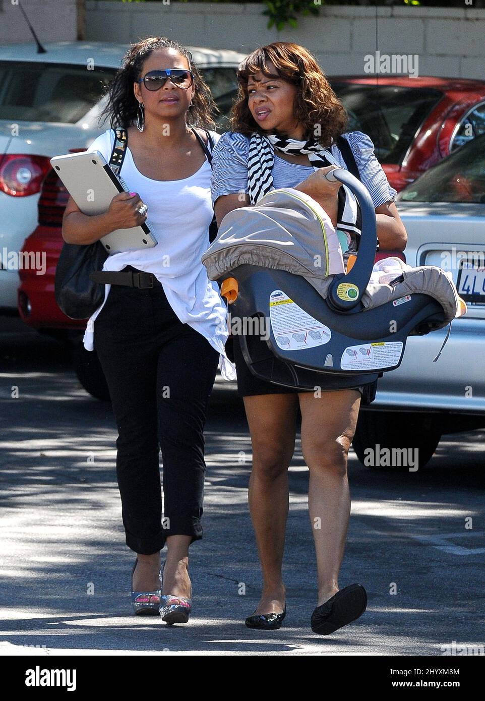 Christina Milian with her daughter Violet and her mother are seen out ...