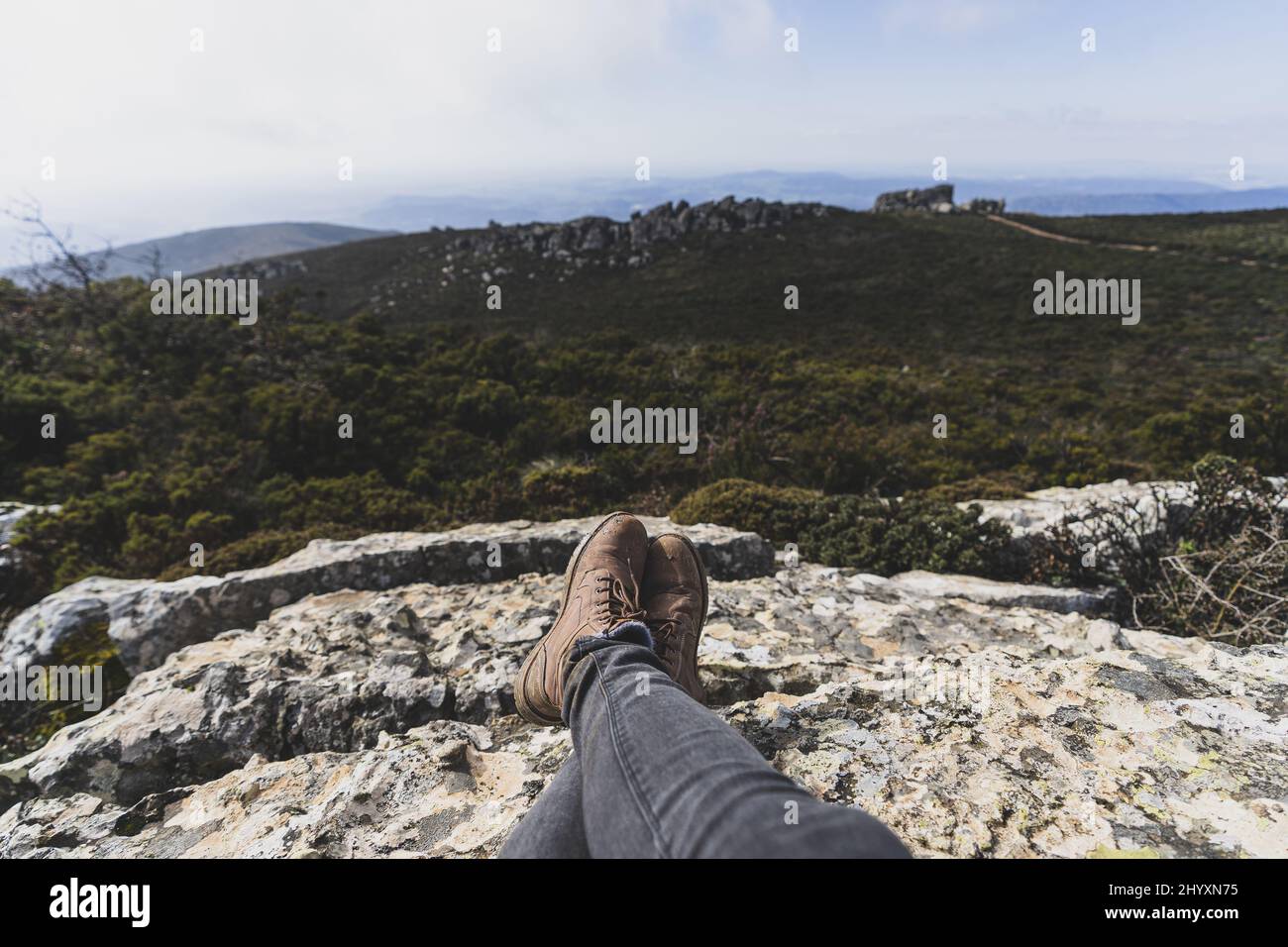 View of the male's feet and the dense forest in the background Stock ...