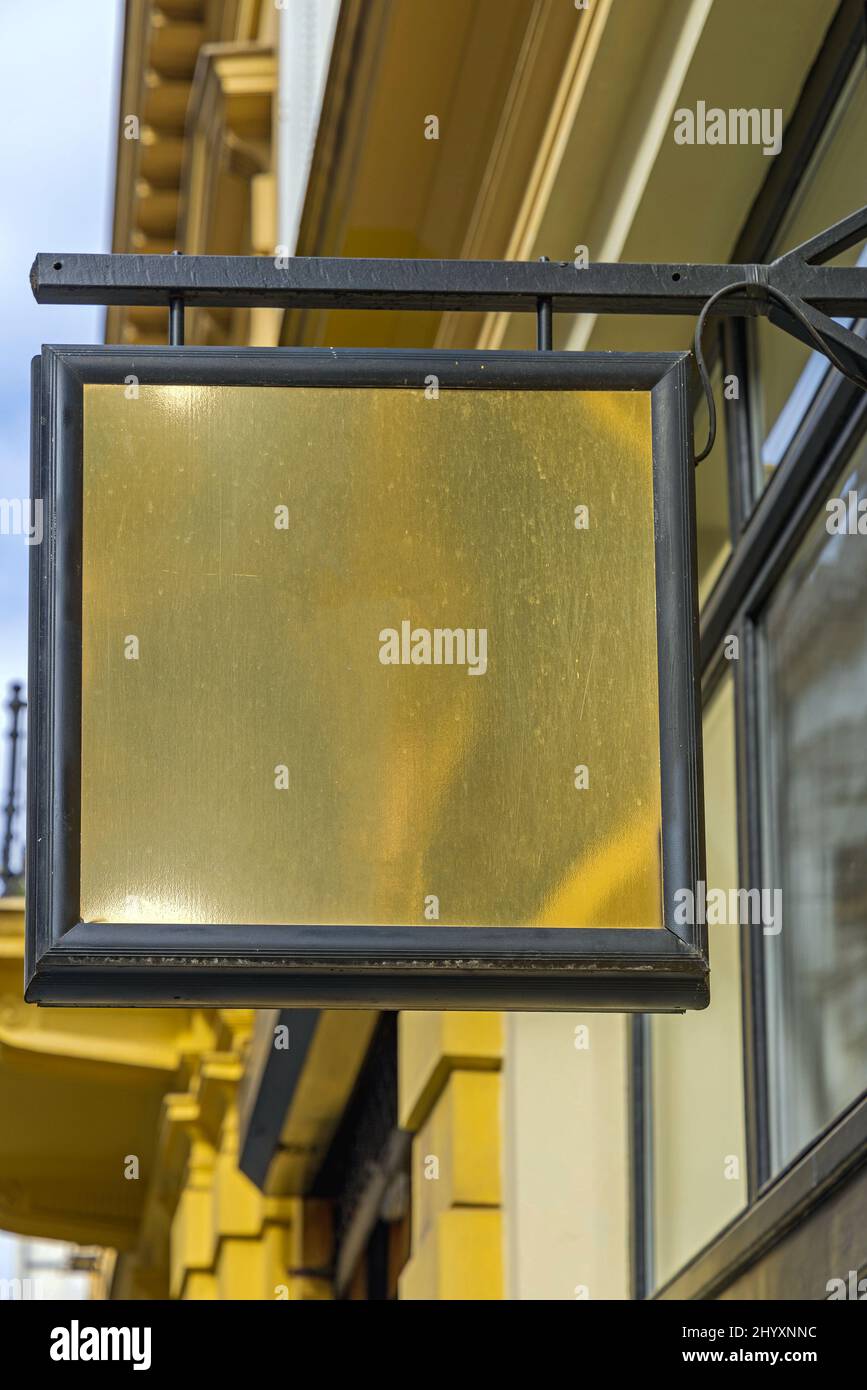 Hanging Golden Metal Sign Board Copy Space Stock Photo - Alamy