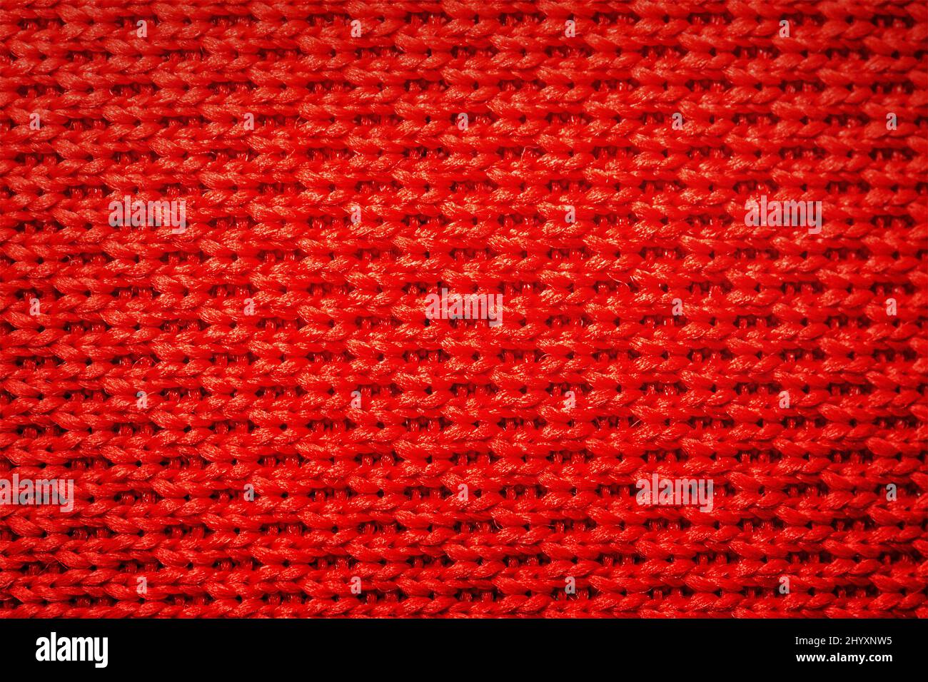 Abstract red background. Red knitting fabric weaving as background ...
