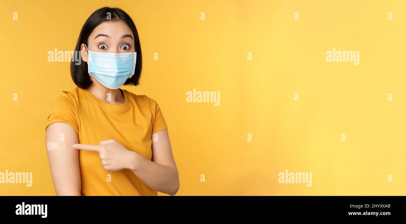 Vaccination from covid and health concept. Excited asian woman in ...