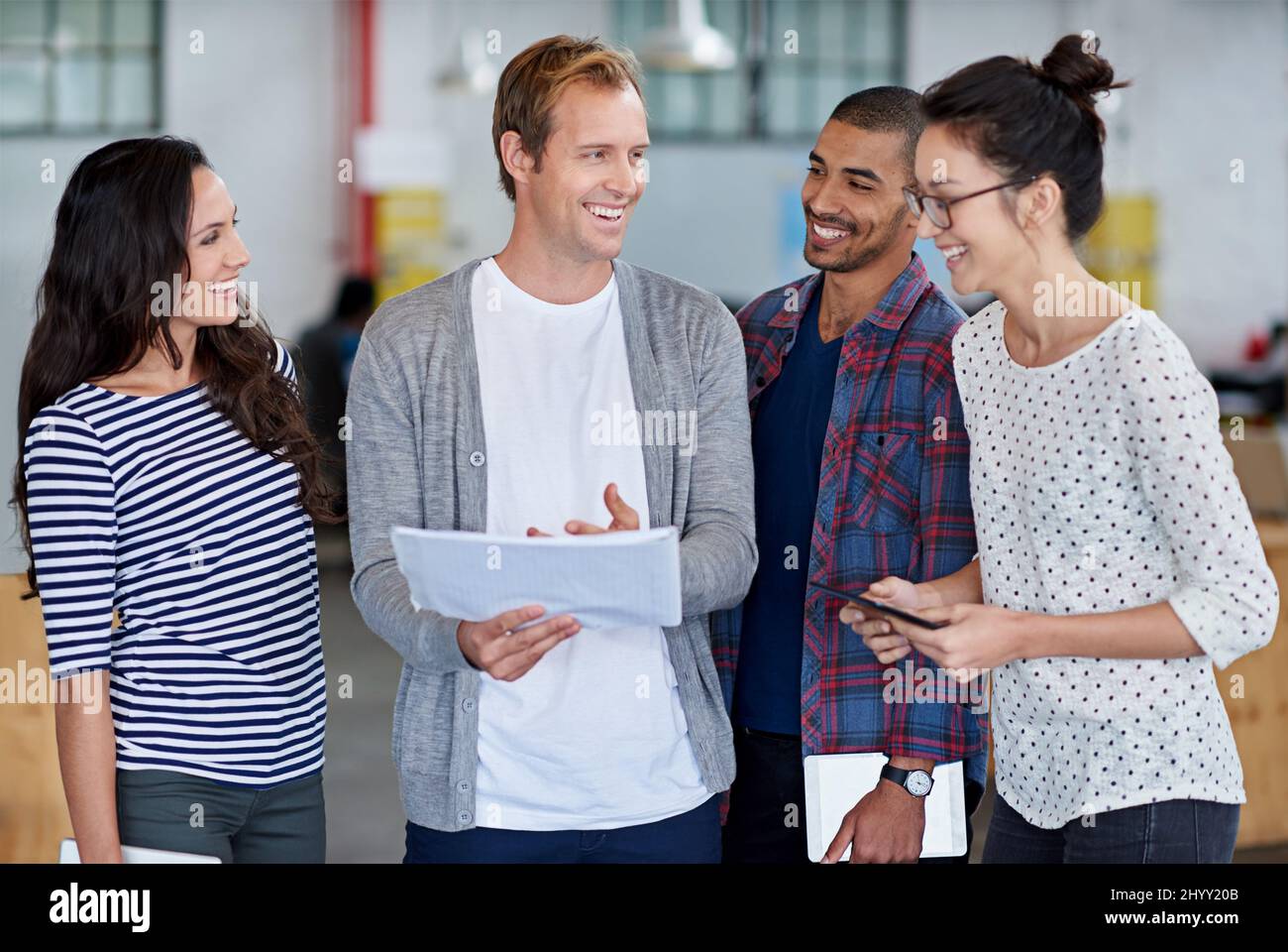 Brainstorming with the gang. Group of office staff having a positive ...