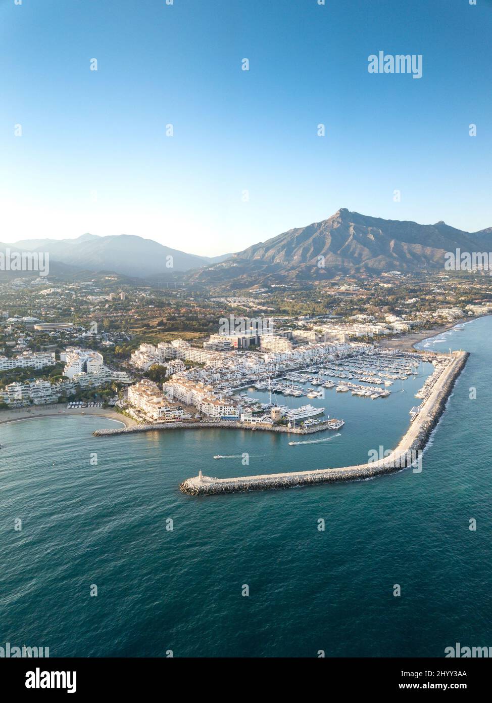 Aerial drone perspective of beautiful sunset over luxury Puerto Banus ...