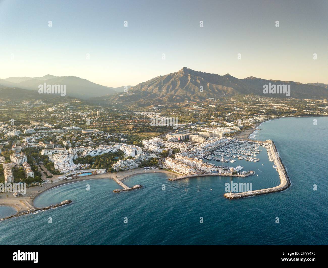 Aerial drone perspective of beautiful sunset over luxury Puerto Banus ...