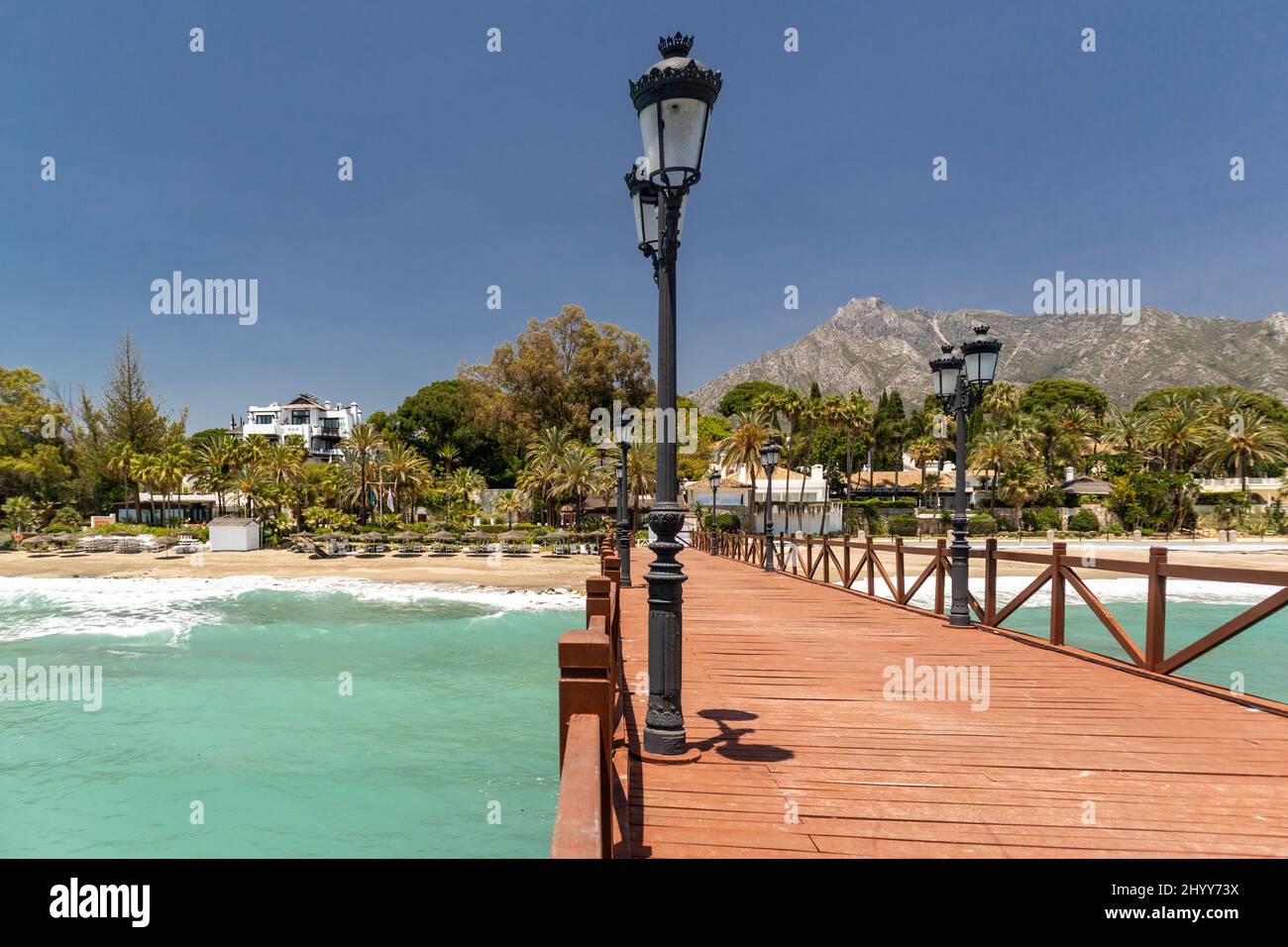 View of red wood bridge "Embarcadero" in Marbella. View of Luxury area ...