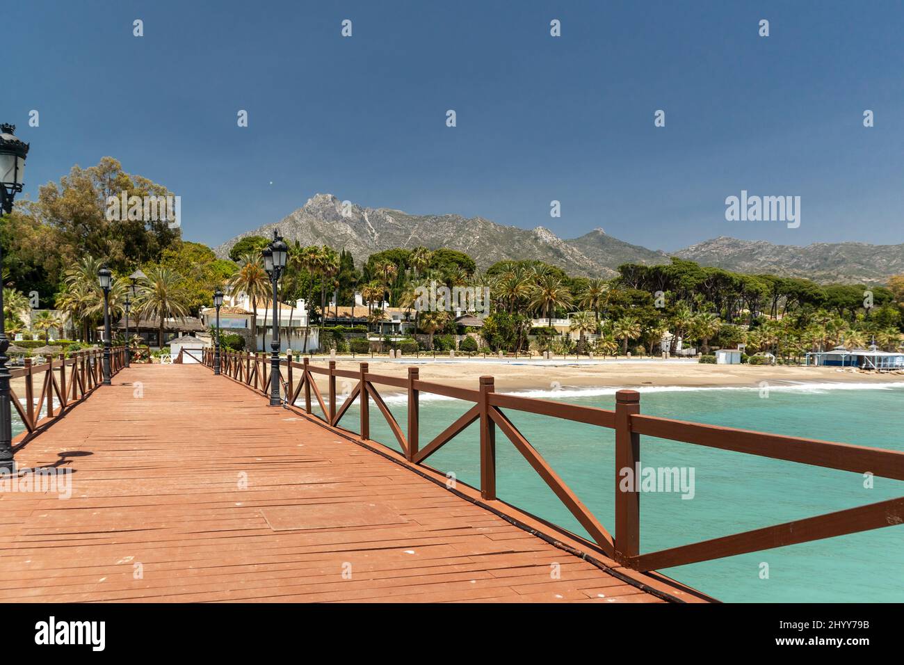 View of red wood bridge "Embarcadero" in Marbella. View of Luxury area ...