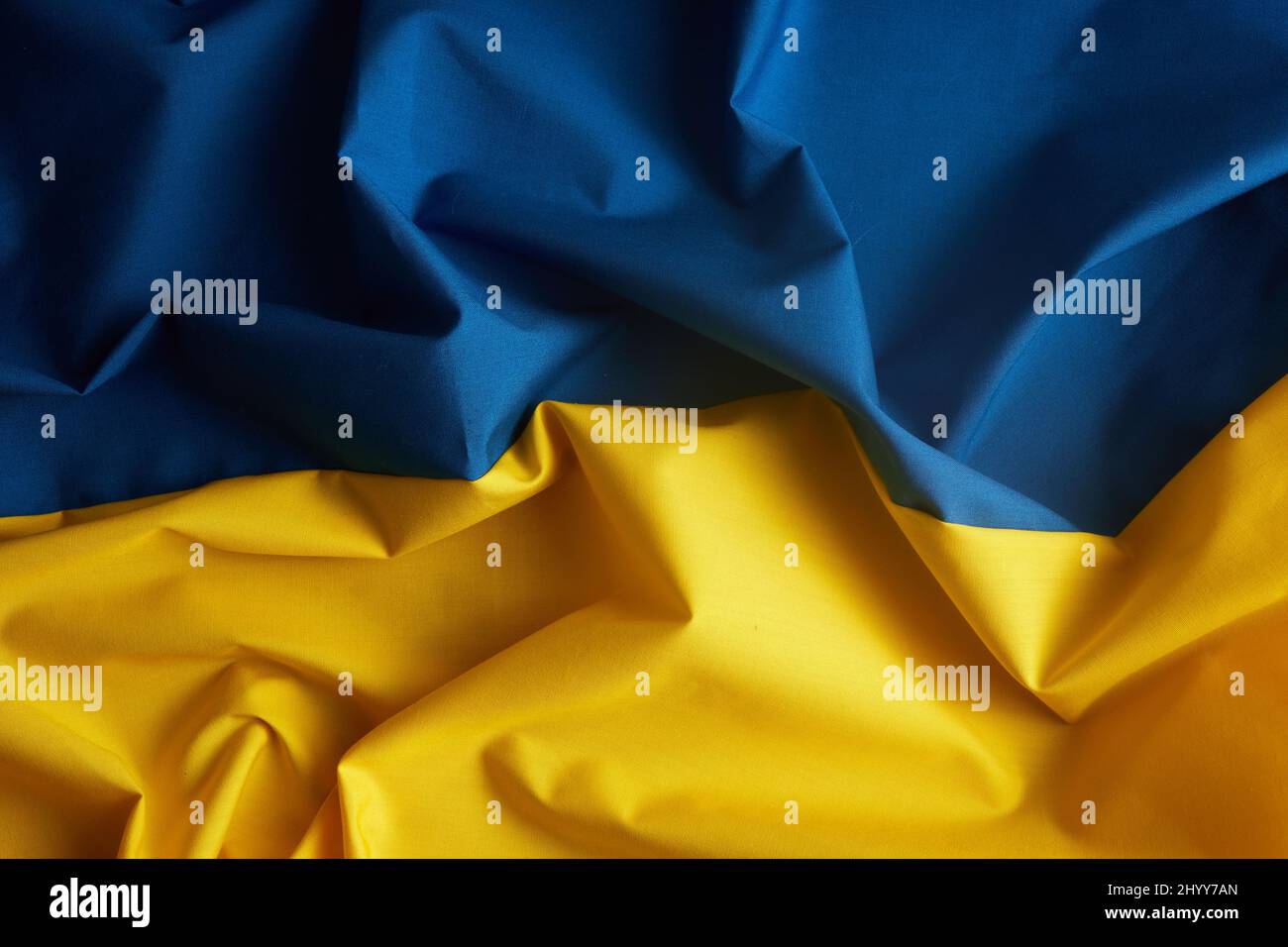 Fabric curved flag of Ukraine. Blue and yellow colors. UA flag ...