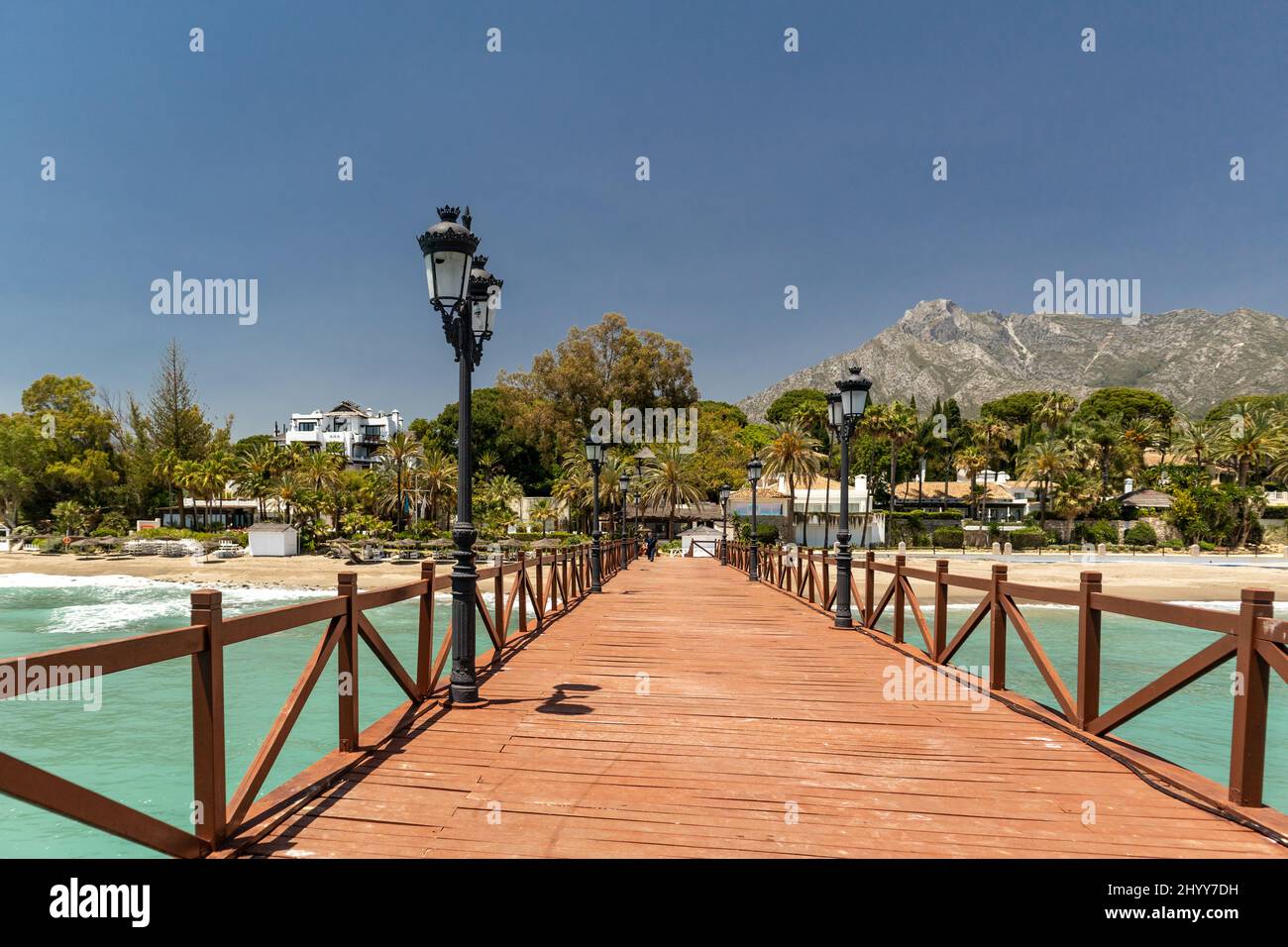 View of red wood bridge "Embarcadero" in Marbella. View of Luxury area ...