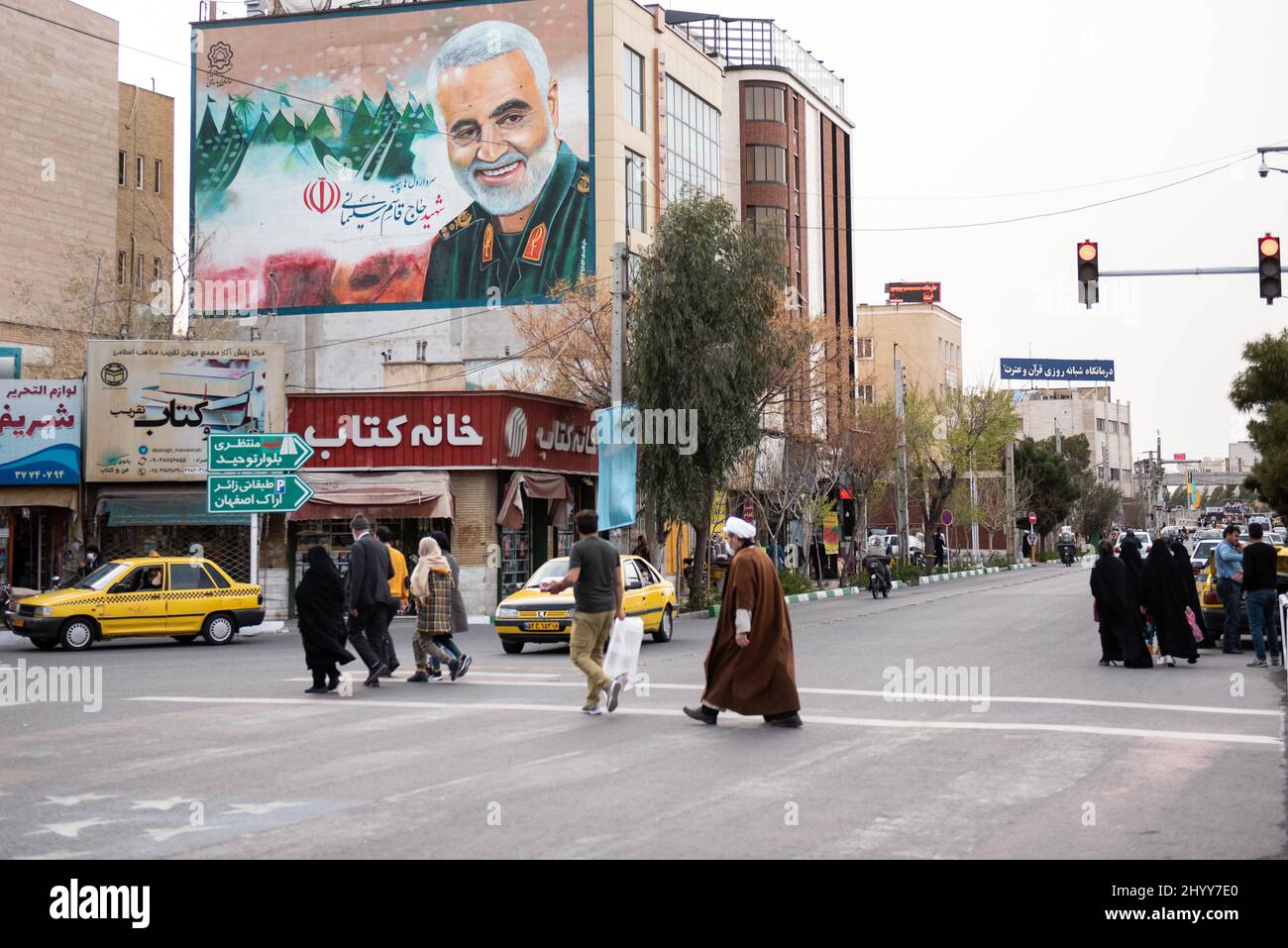 (3/10/2022) people walk past a Portrait of the Iranian Gen. Qassem ...