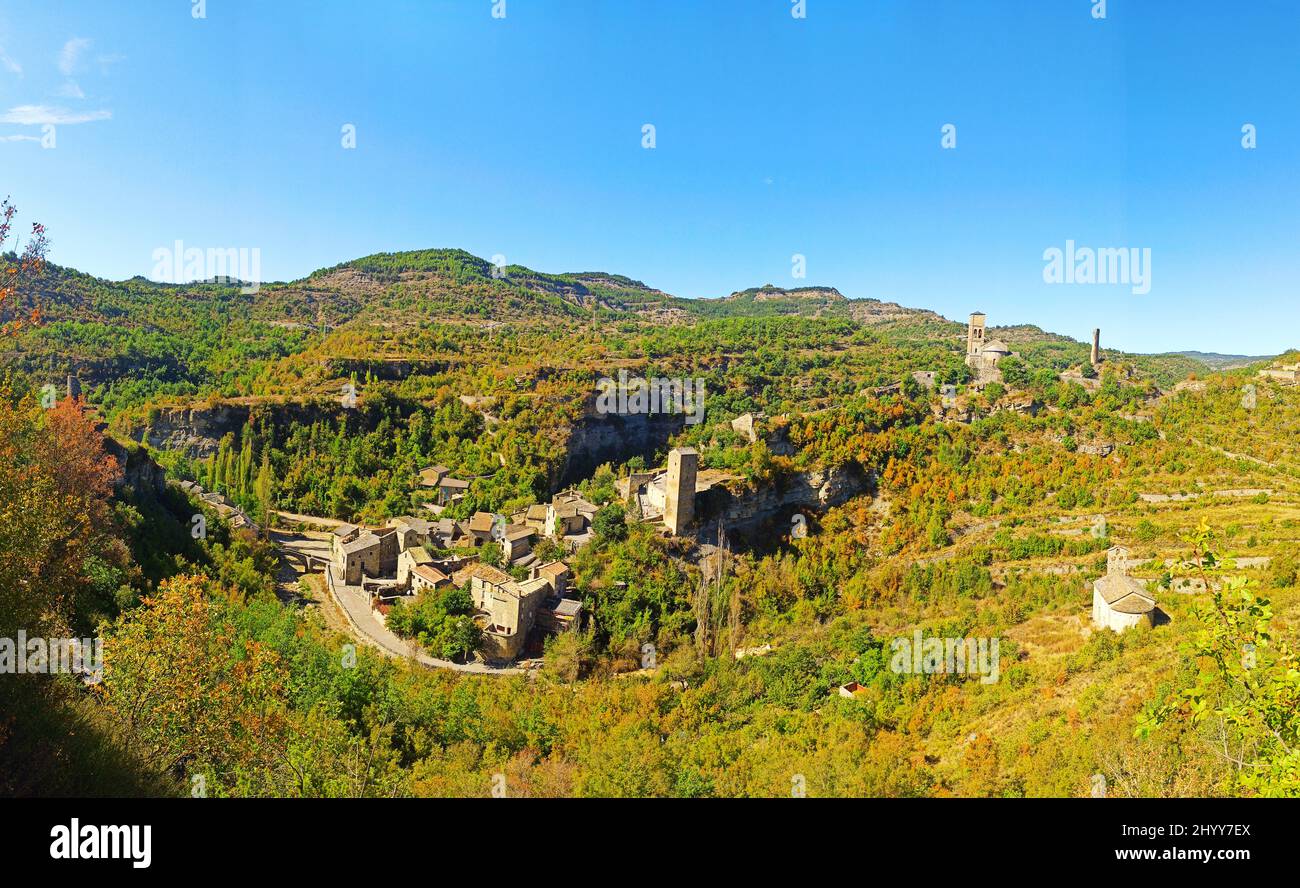 Distant view of the landscape with houses, mountain and forests on a ...