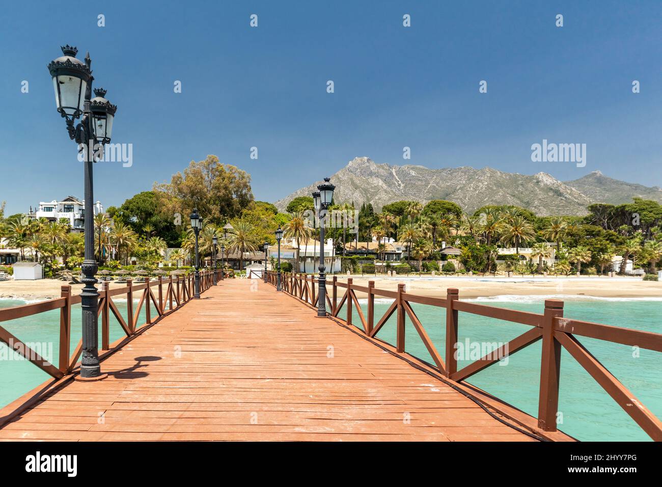 View of red wood bridge "Embarcadero" in Marbella. View of Luxury area ...