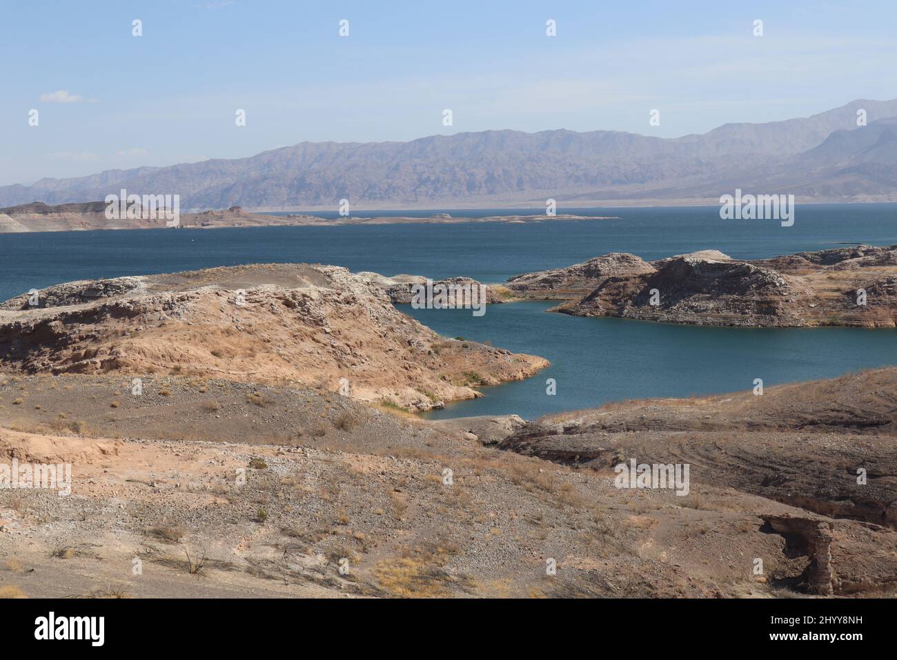 Scenic view of an arid landscape with a blue lake in Lake Mead National ...