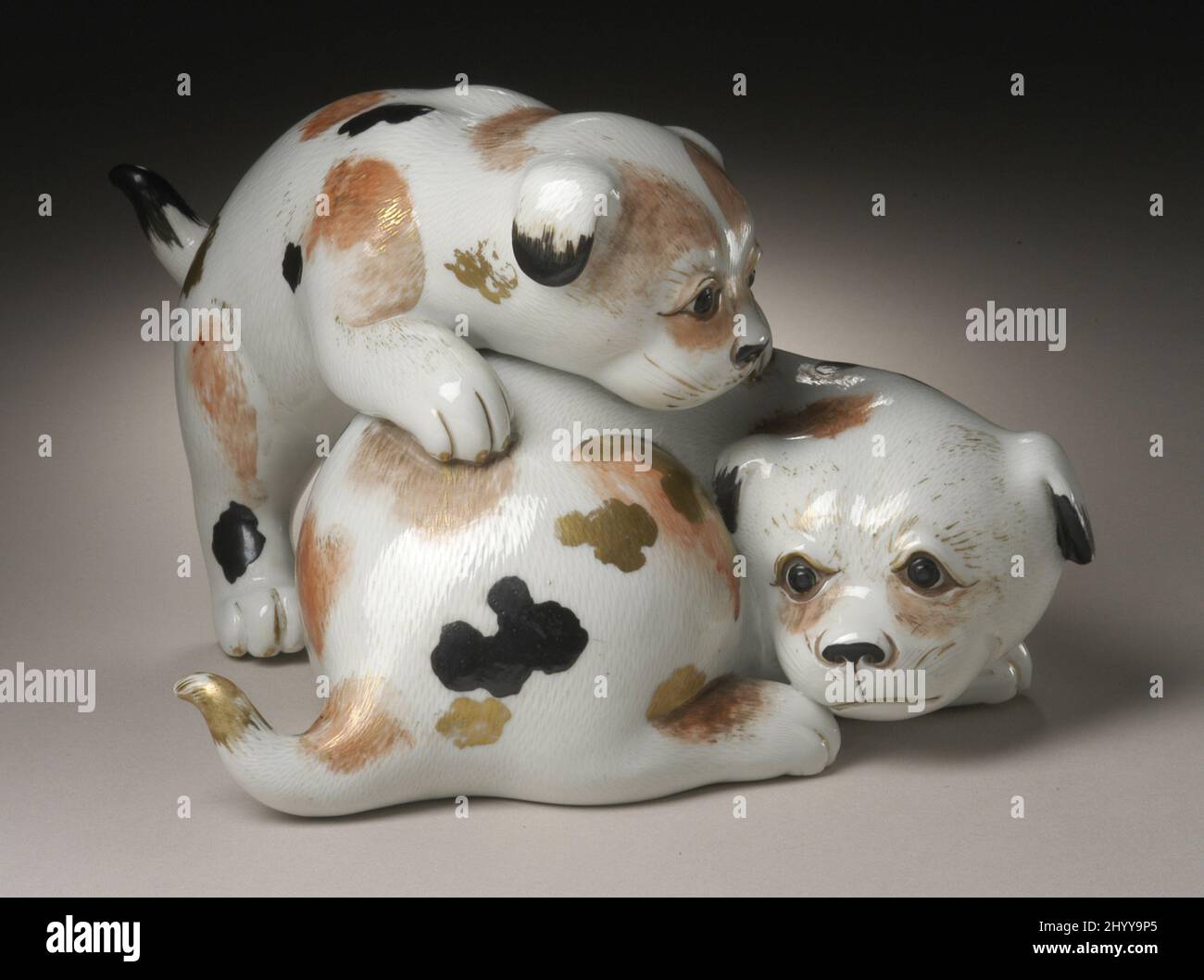 Okimono in the Form of a Pair of Gamboling Piebald Puppies. Japan, 19th ...
