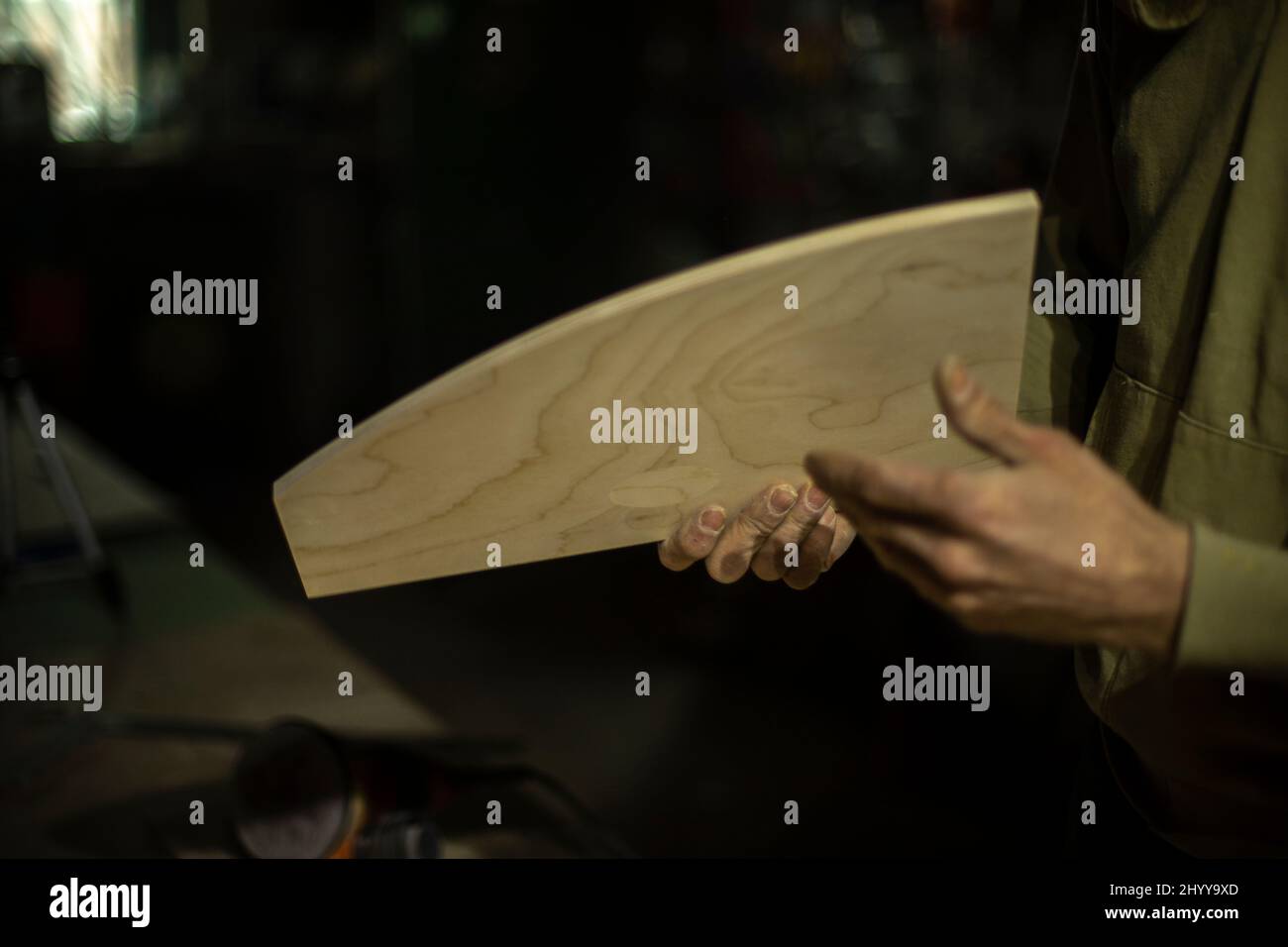 Carpenter holds board. Details of woodwork. Joinery. Work on assembly ...