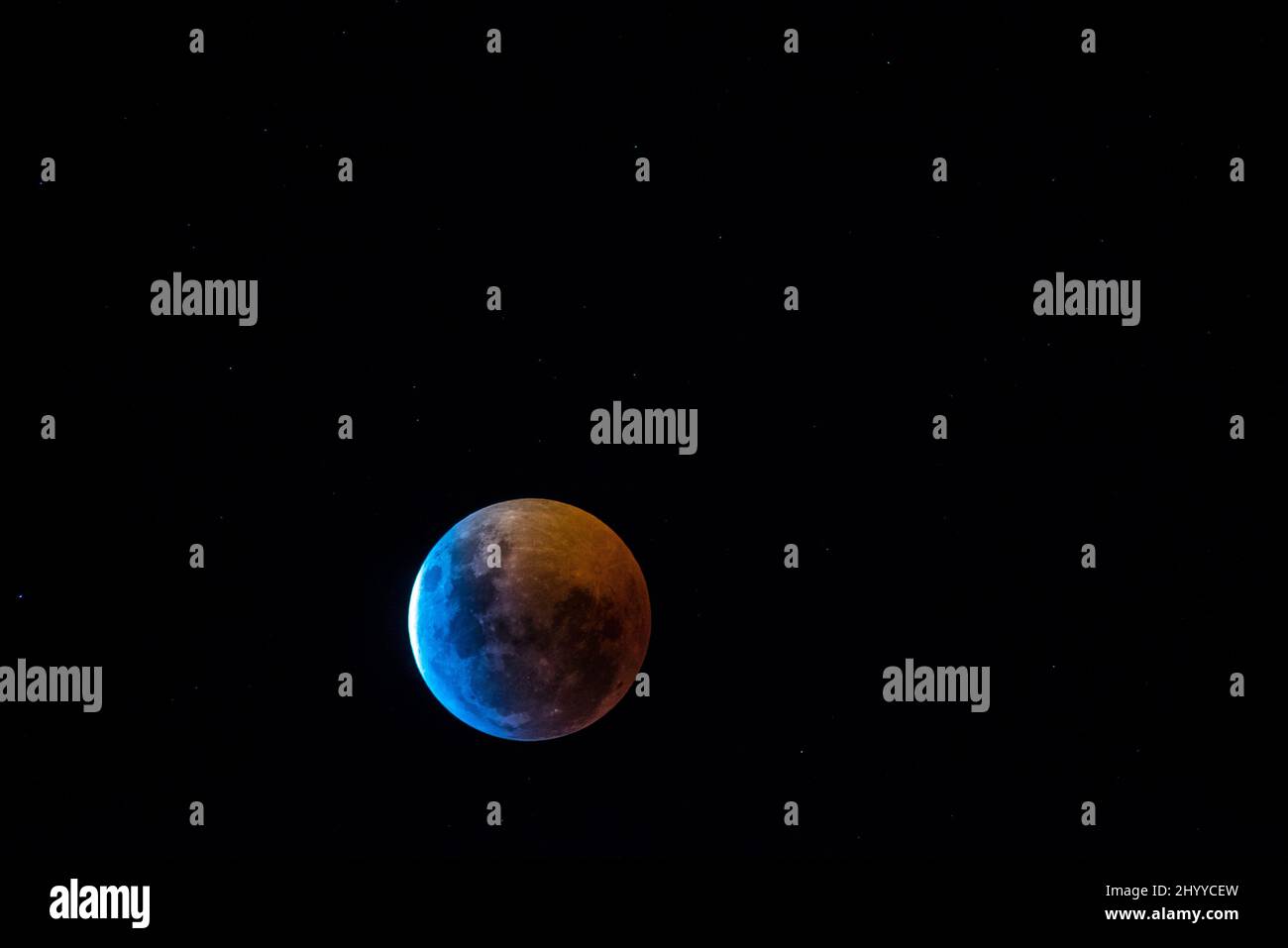 Moon sinking into shadow, lunar eclipse Stock Photo - Alamy