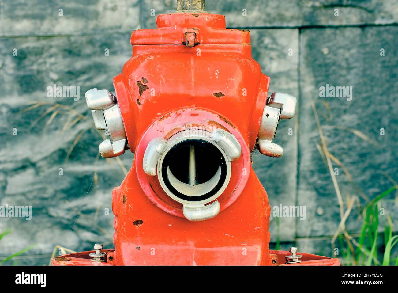 detail of a red fire hydrant detail for firefighters on the street ...