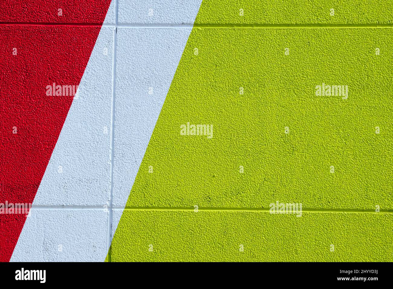 wall of red white and yellow colors on a building exterior Stock Photo ...