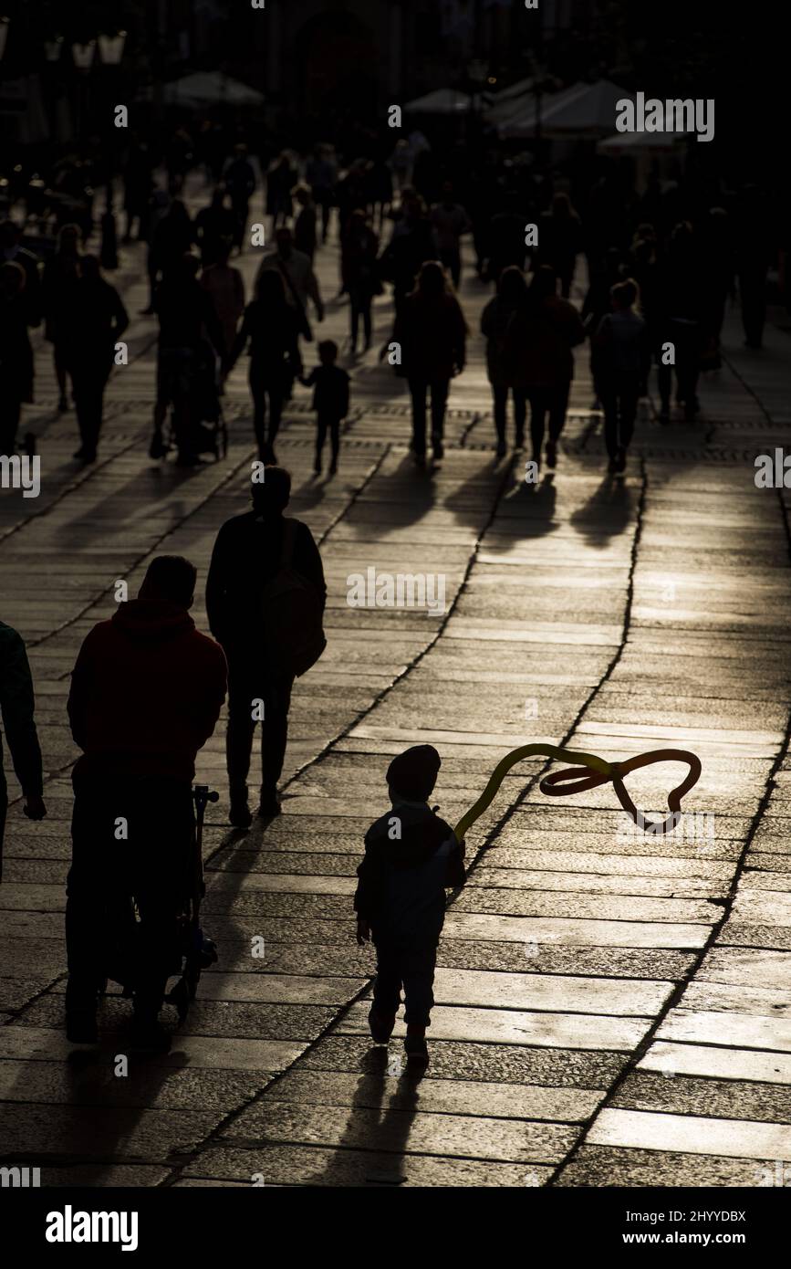 Vertical shot of people walking in the street Stock Photo - Alamy