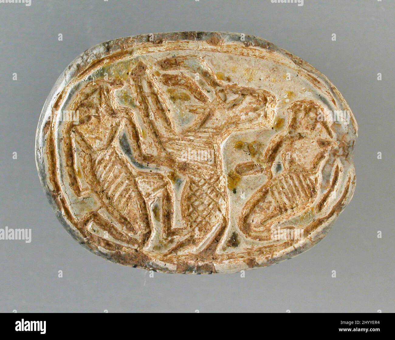 Scarab Depicting Two Stylized Human Figures on either Side of a Gazelle ...