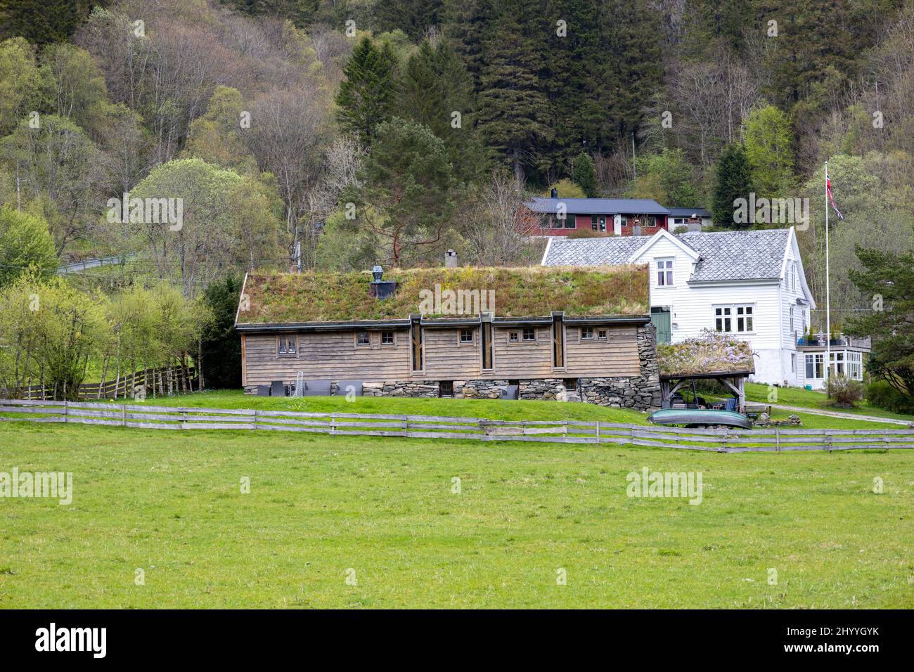 Rural area with small wooden buildings, grassland and forest Stock ...
