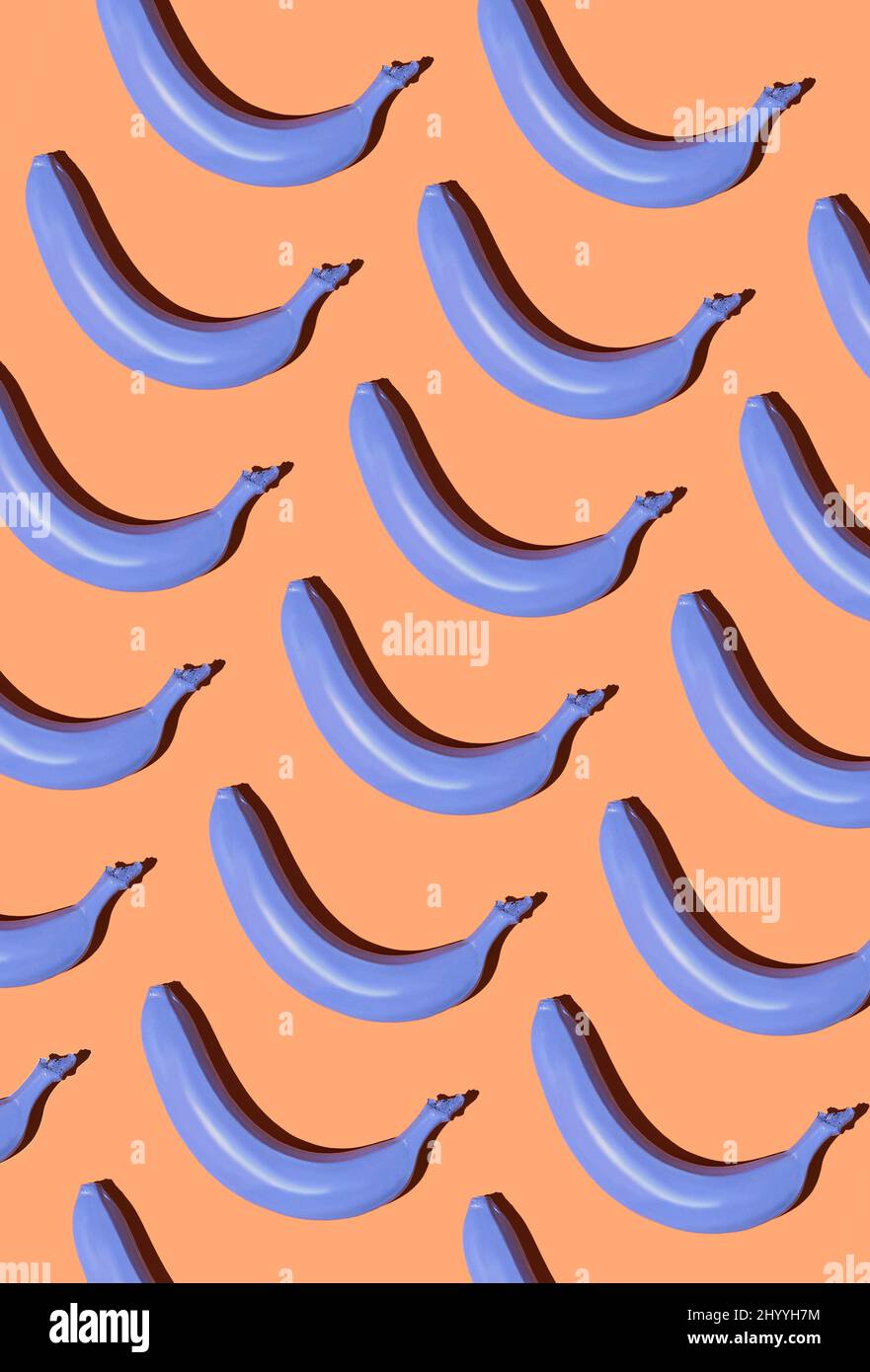 Graphic top view pattern of purple bananas in diagonal lines on pastel ...