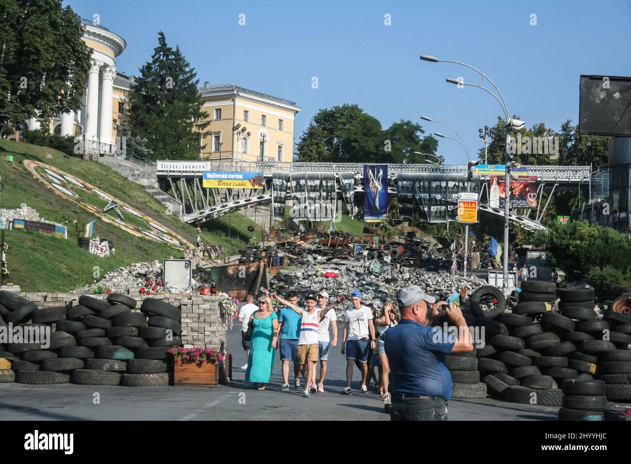 KYIV, UKRAINE - AUGUST 5, 2014: People passing by a Euromaidan ...