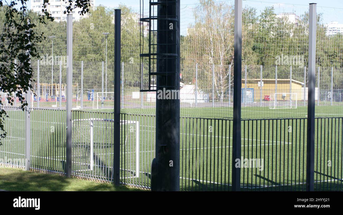 football field near fence at day sunny day Stock Photo - Alamy