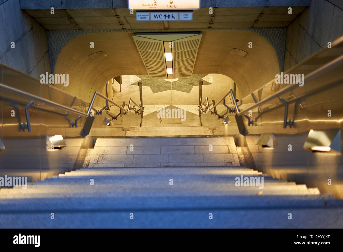 Steps down to the subway station. Illuminated exit to public transport ...