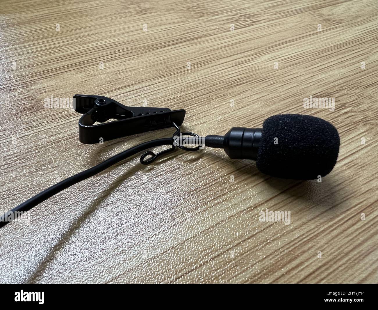 Lavalier lapel microphone with cord on light wooden surface, Lafayette ...