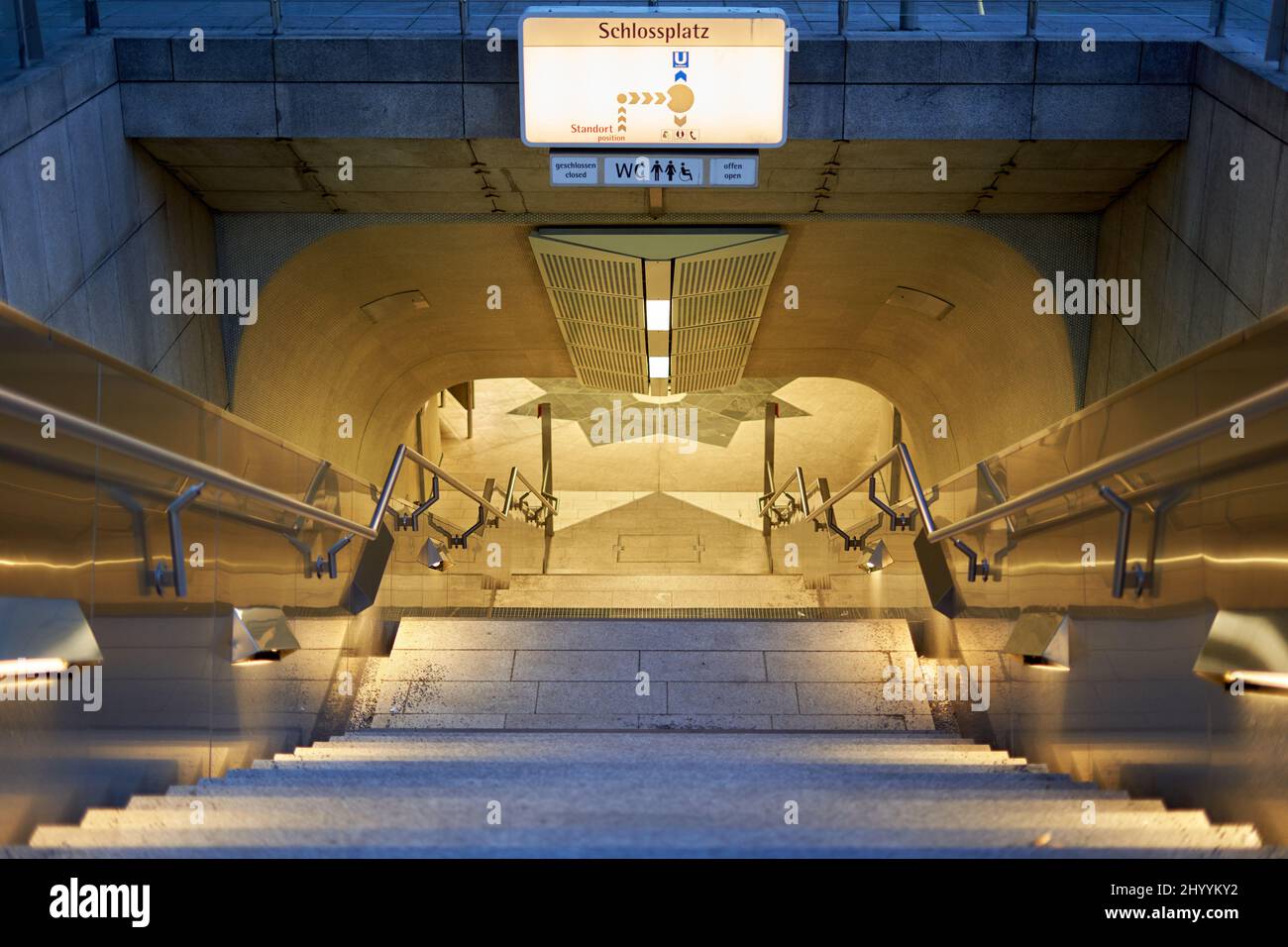 Steps down to the subway station. Illuminated exit to public transport ...