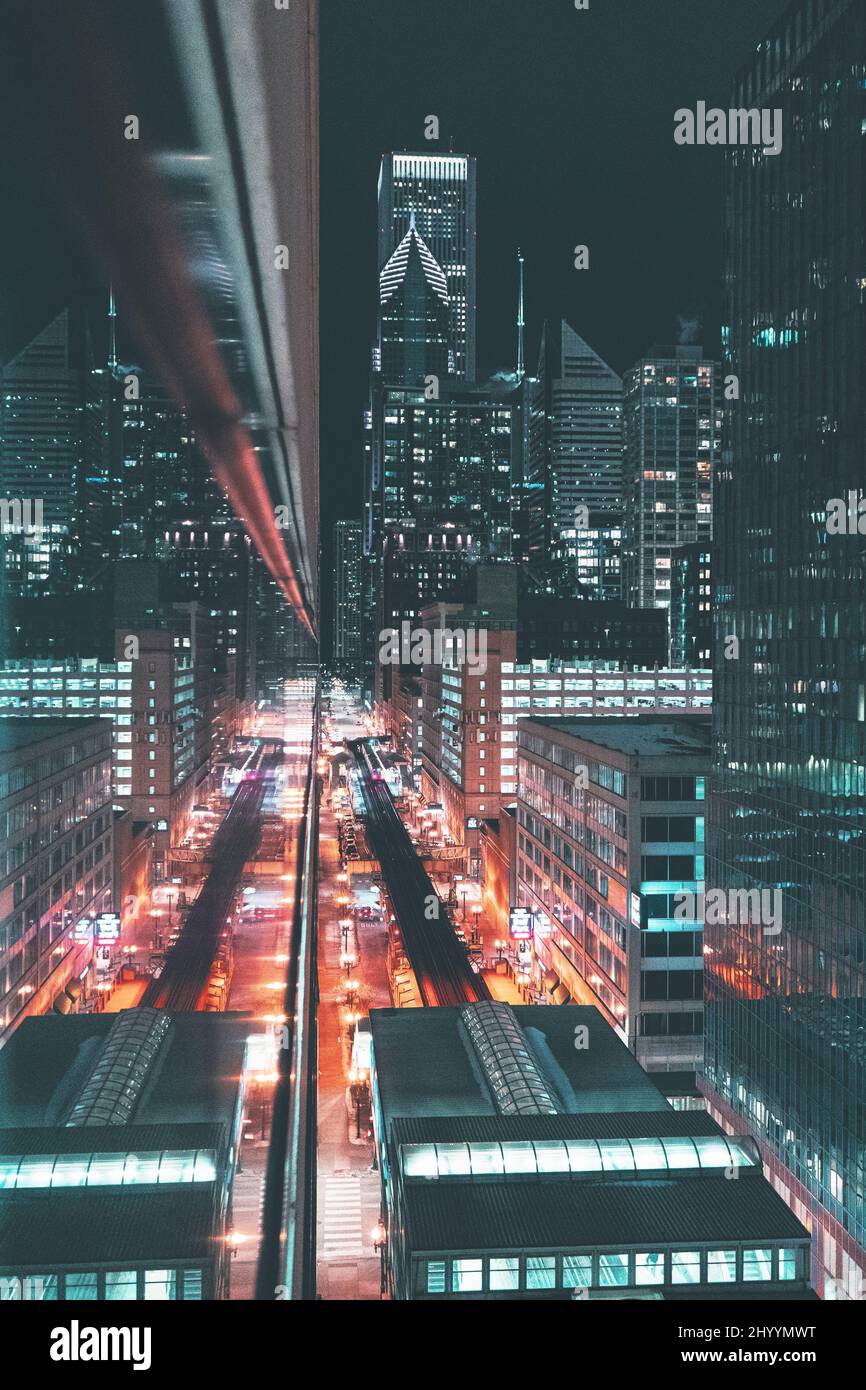 Chicago's nighttime reflection in the railroad track Stock Photo - Alamy
