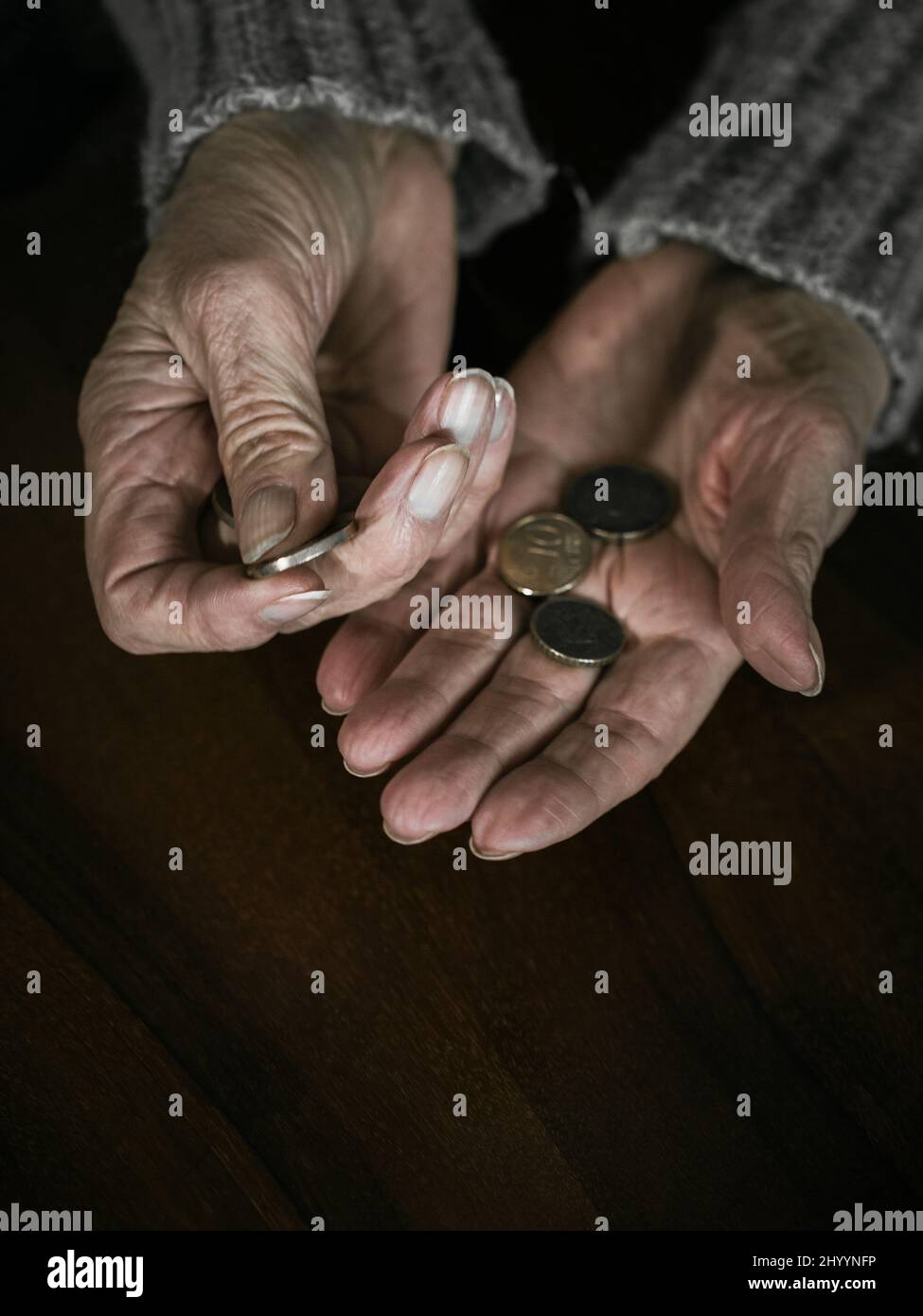 Woman hands counting coins hi-res stock photography and images - Alamy