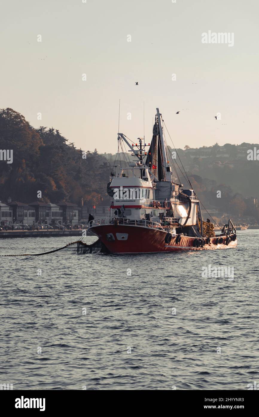 Pulling the fishing net on the ship. Fishing ship big fishermen with ...