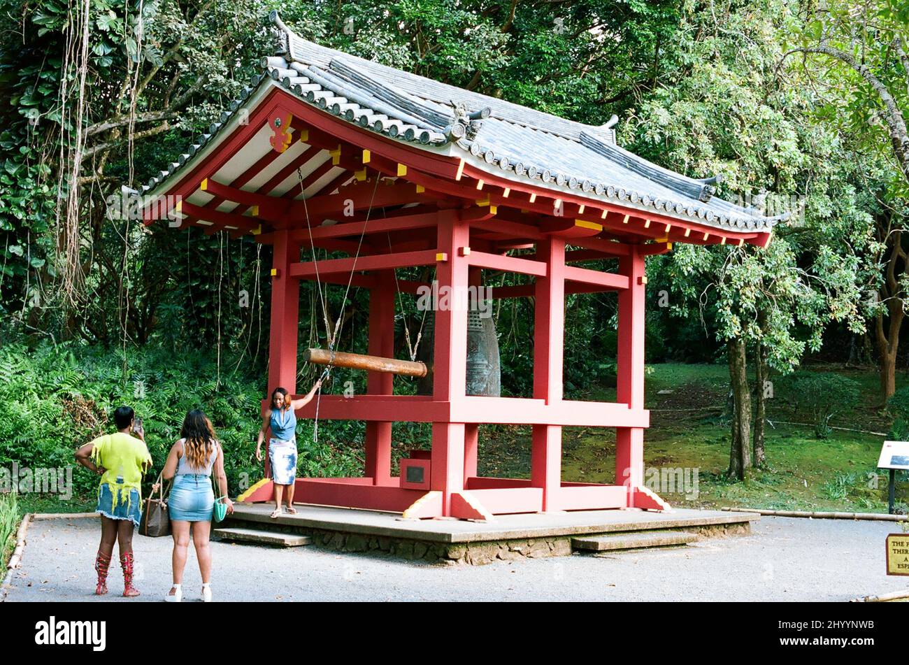 Byodo-in Temple Gong Bell being rung by tourists in Oahu Hawaii Stock ...