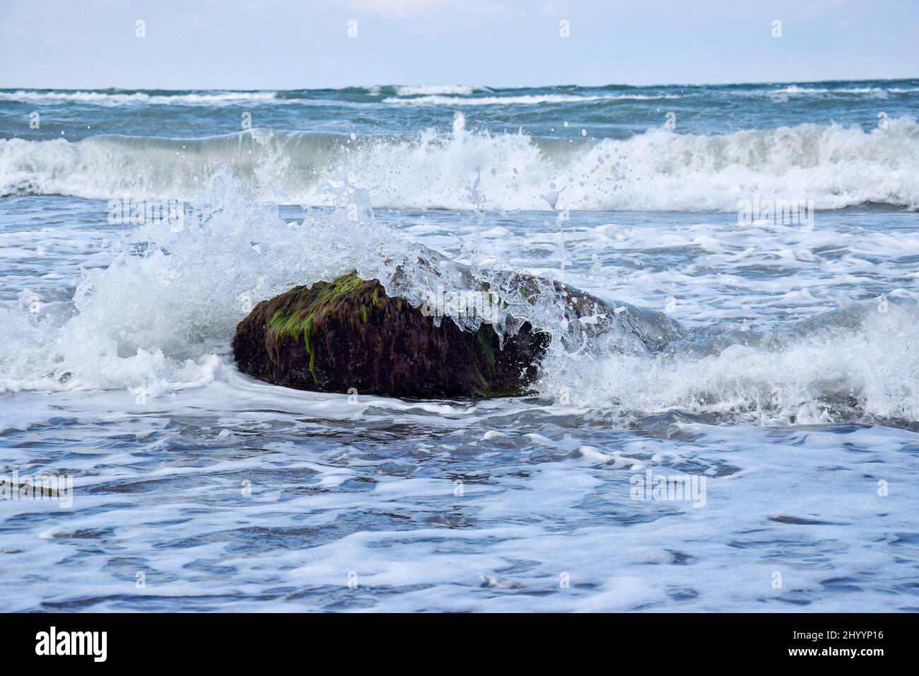 Water splashing over rock Stock Photo - Alamy